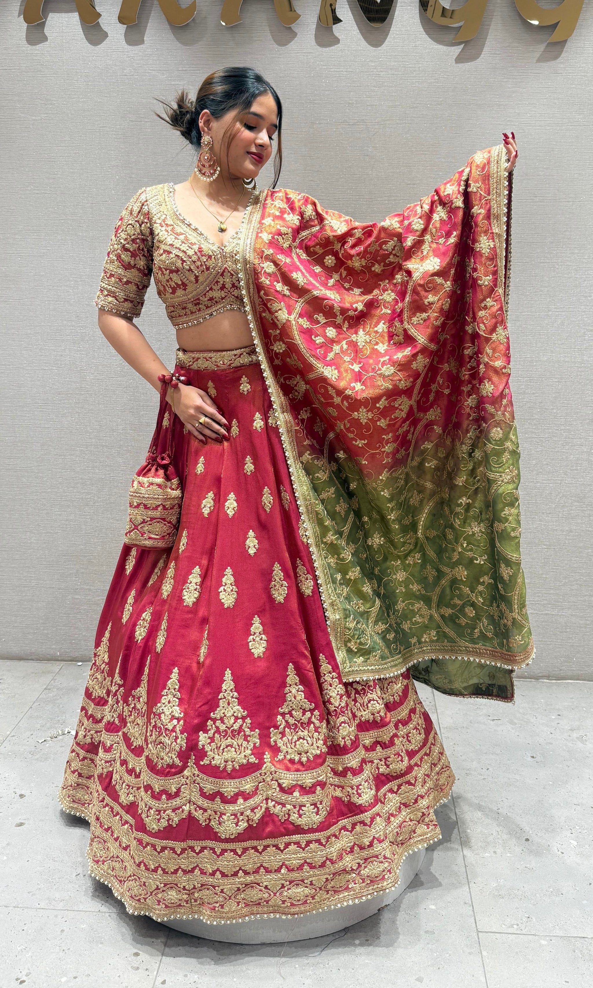 Brick red and green Lehenga with potli